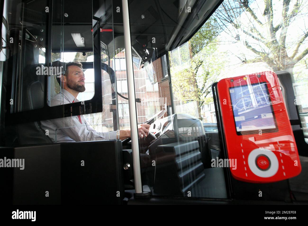 A bus driver pictured in action during the presentation of the first ...
