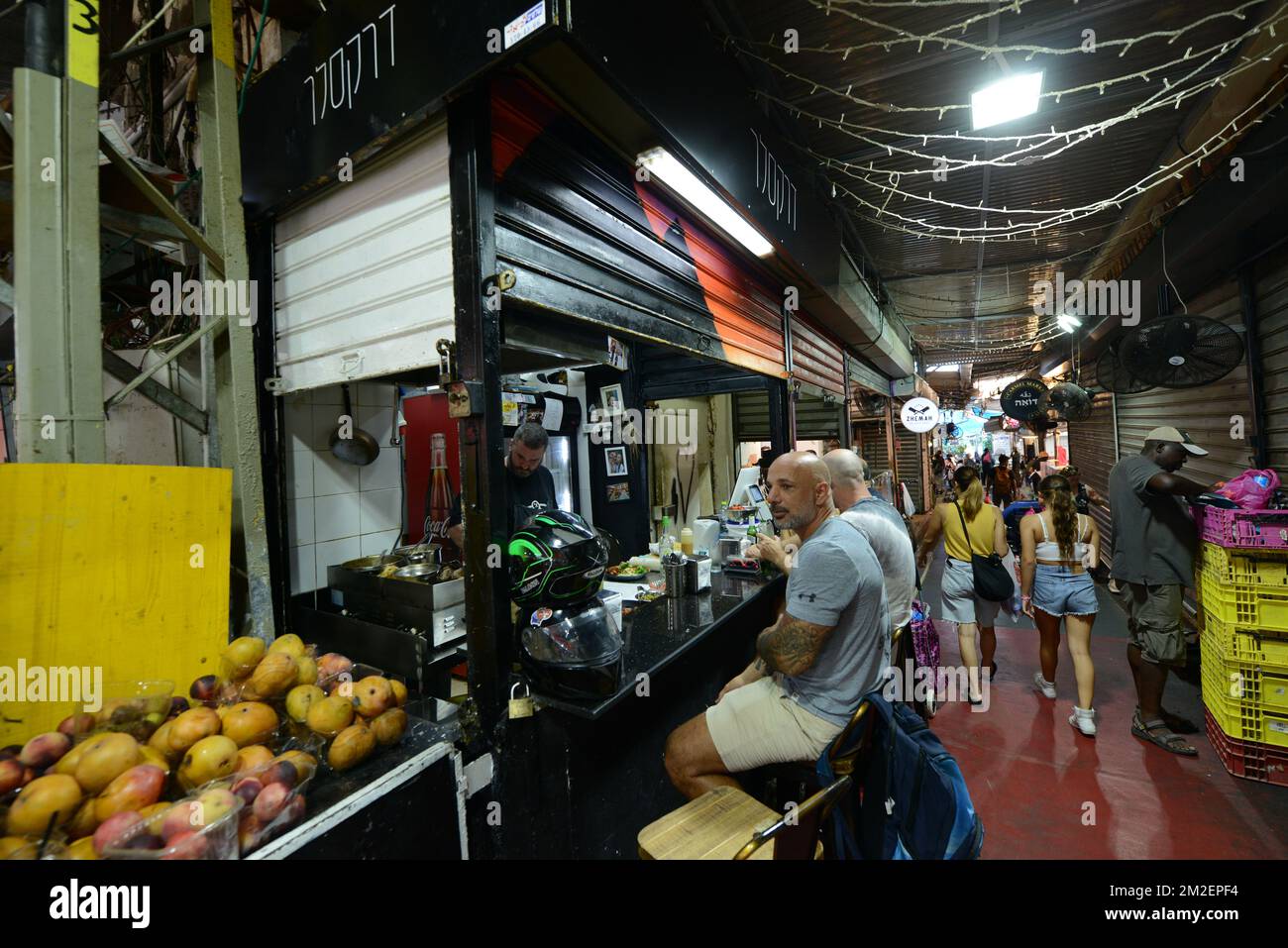 Vibrant bars in the narrow street of the Carmel market in Tel-Aviv ...