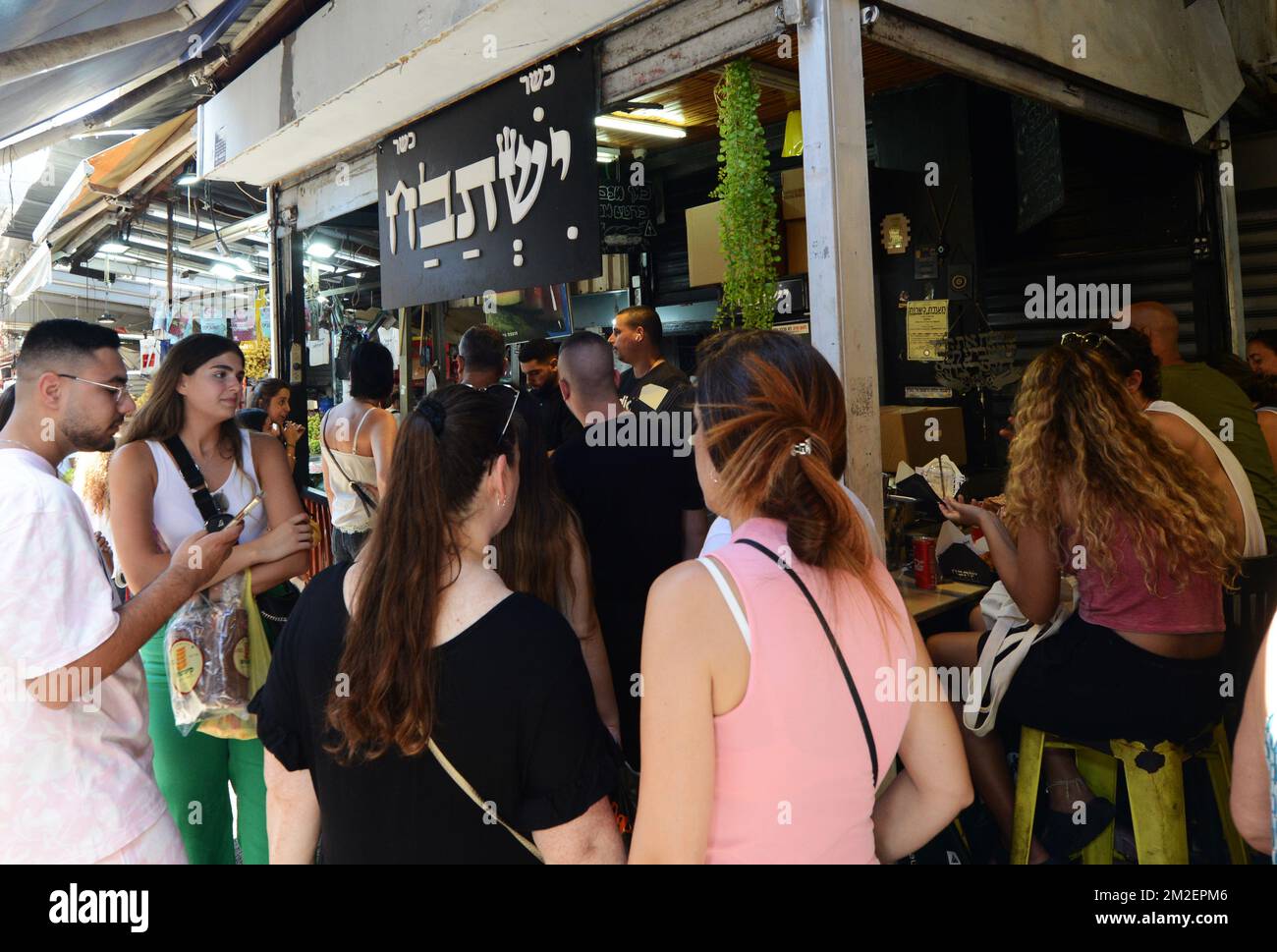 Vibrant bars in the narrow street of the Carmel market in Tel-Aviv ...