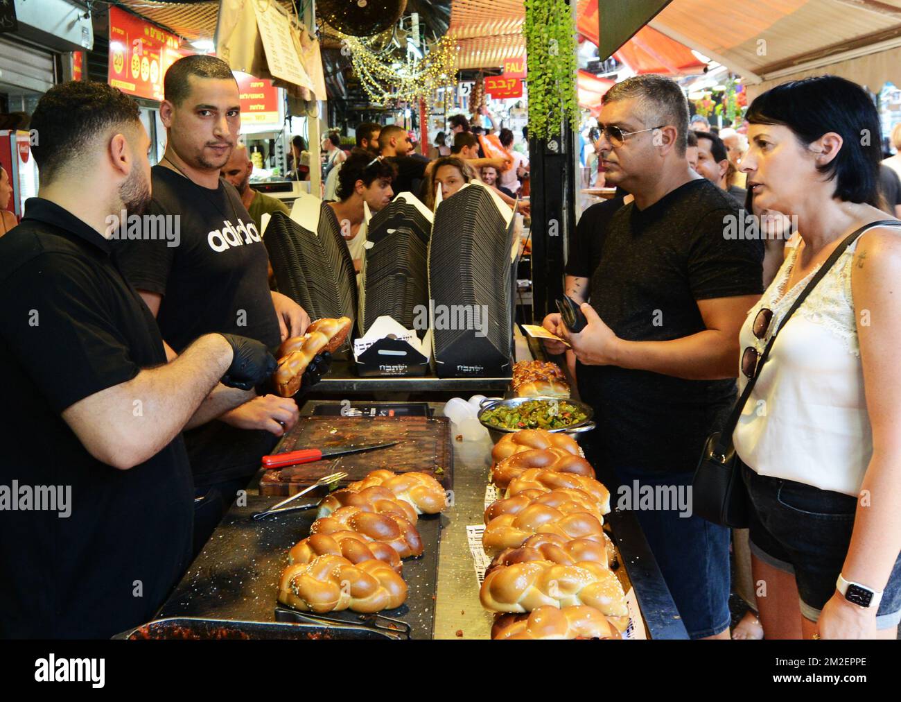 Vibrant bars in the narrow street of the Carmel market in Tel-Aviv ...