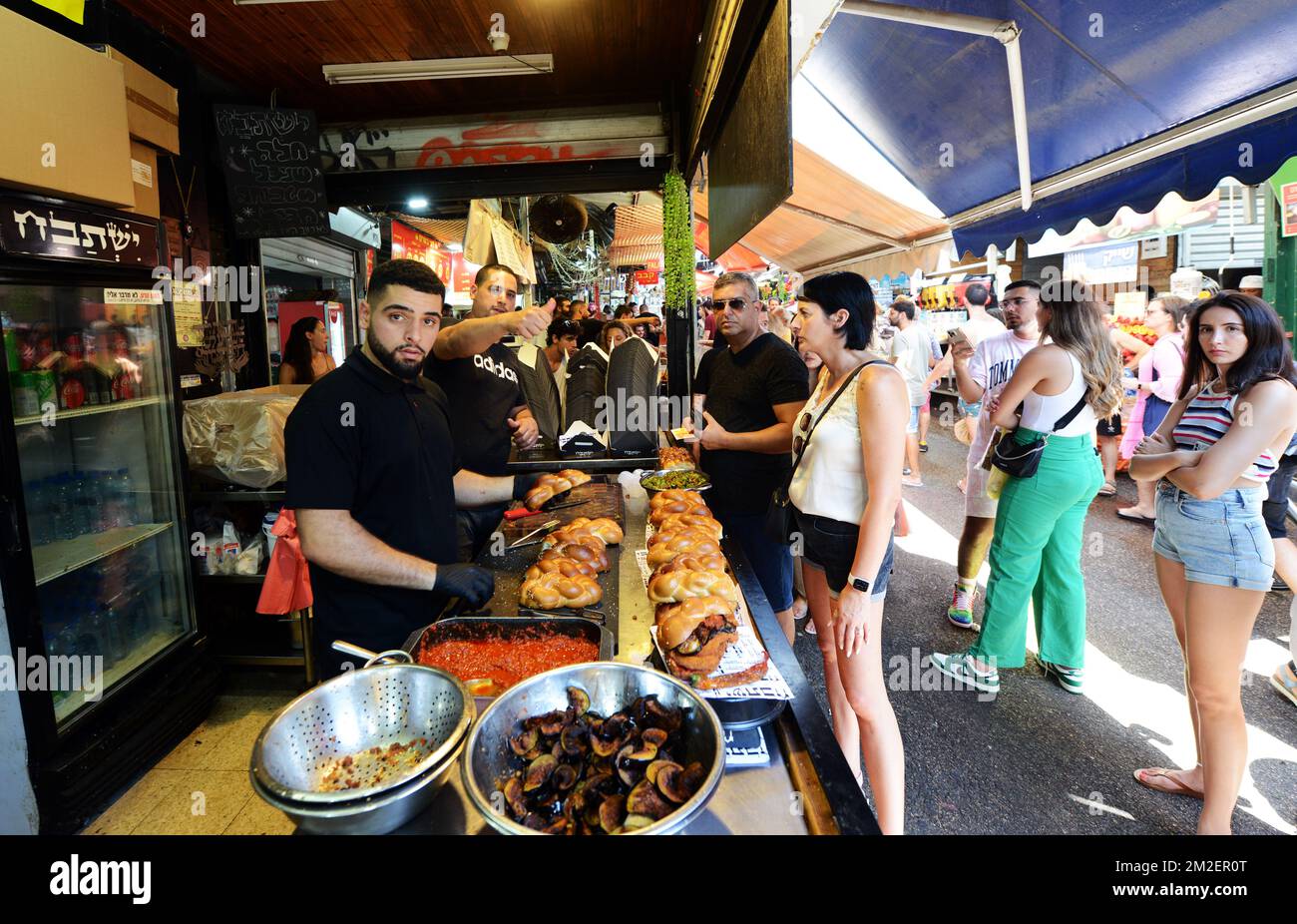 Vibrant bars in the narrow street of the Carmel market in Tel-Aviv ...