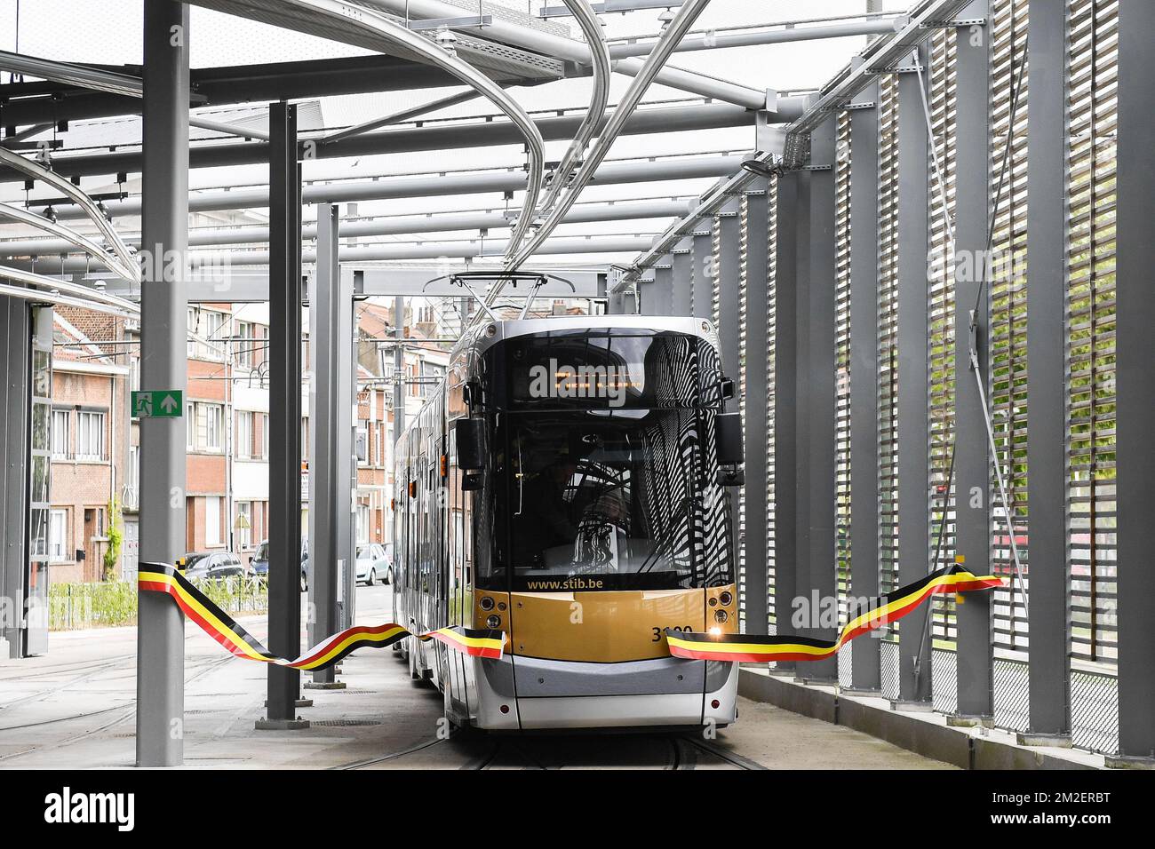 Illustration picture shows a tram breaking a ribbon in the colours of ...