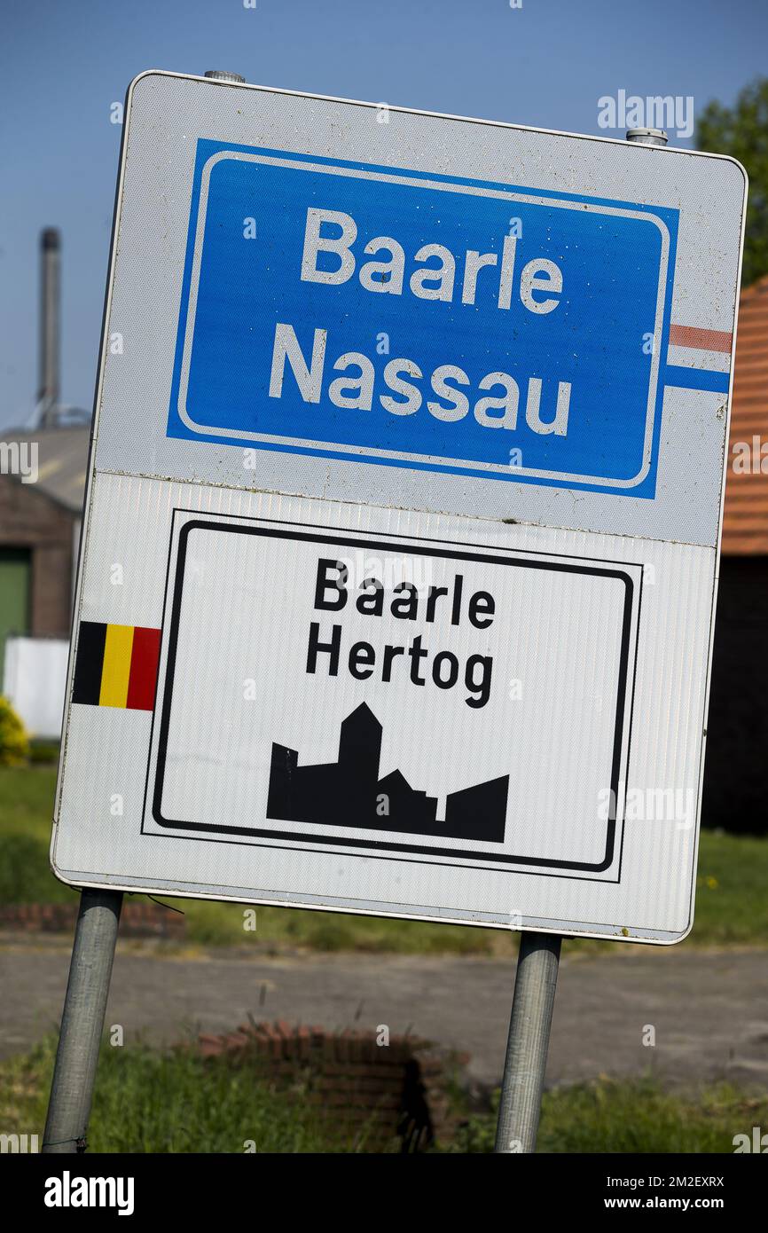 Illustration shows the name of the Baarle-Hertog municipality on a road ...
