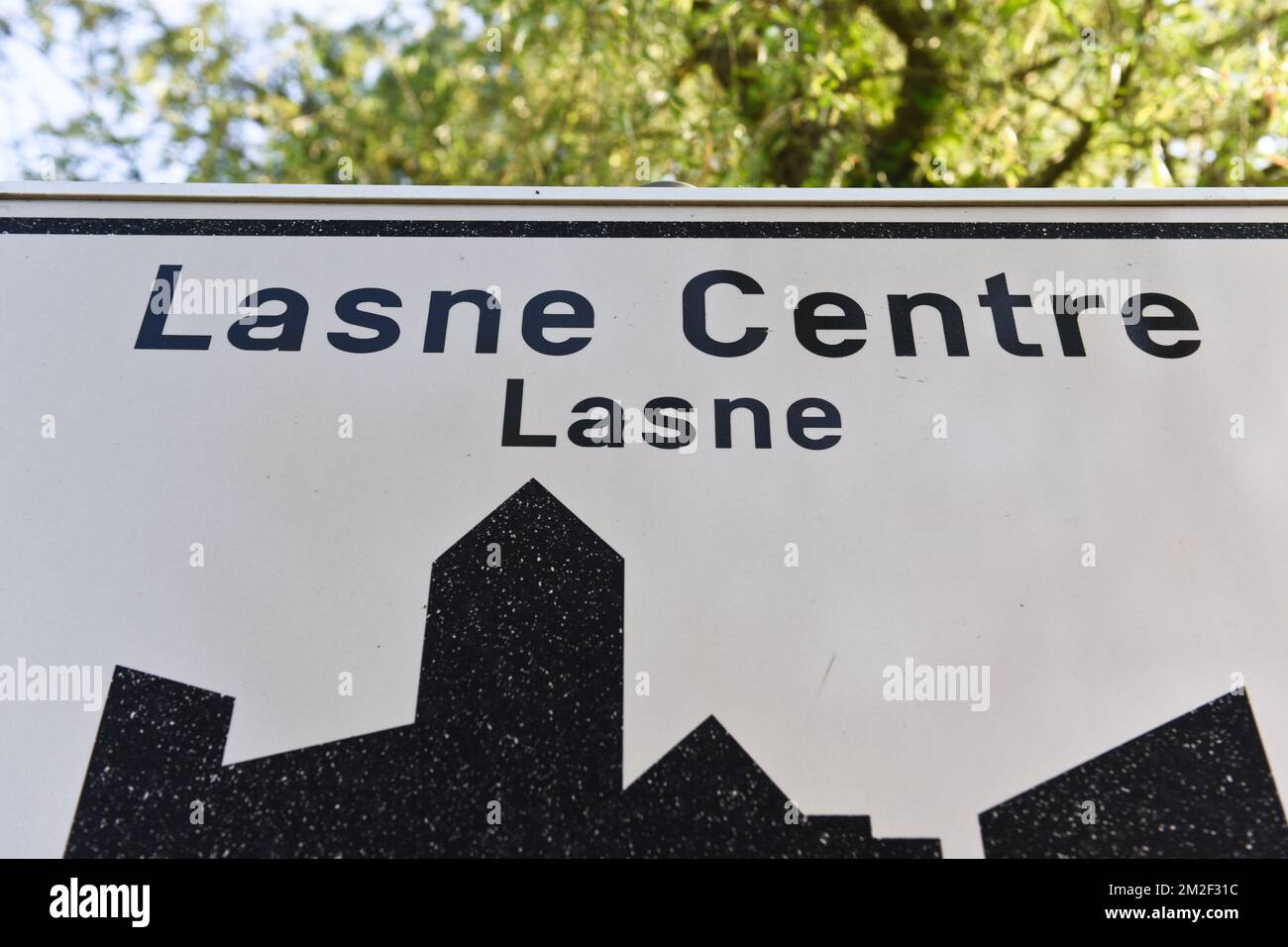 Illustration shows the name of the Lasne municipality on a road sign ...