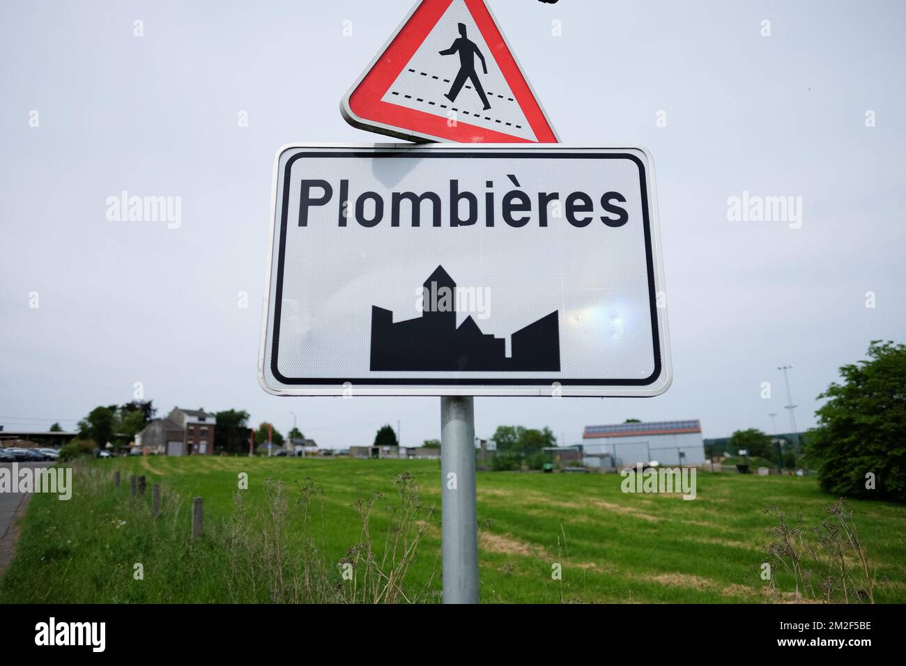 Illustration shows the name of the Plombieres municipality on a road ...