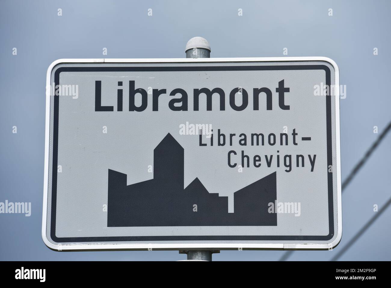 Illustration shows the name of the Libramont municipality on a road ...