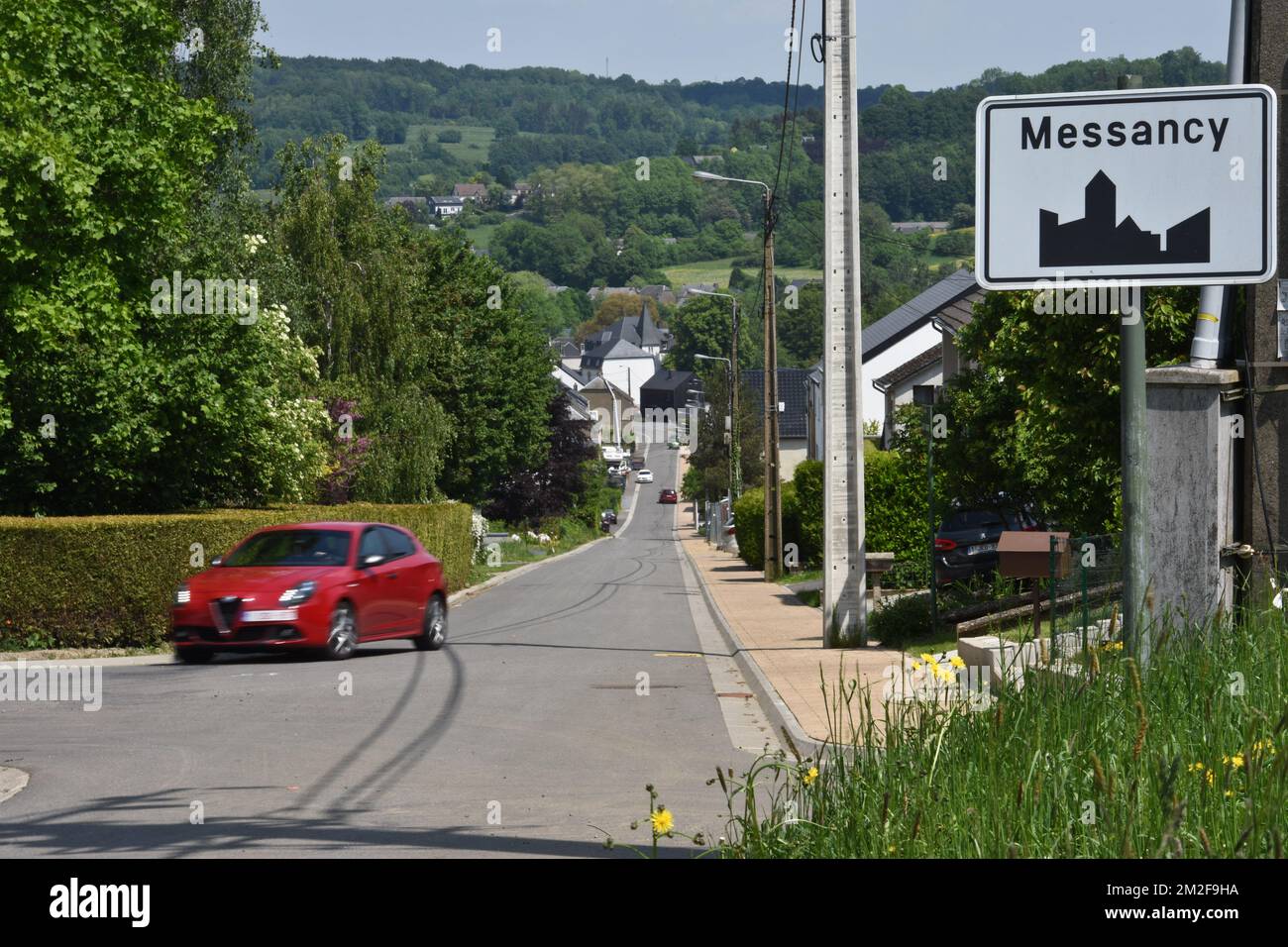 Illustration shows the name of the Messancy municipality on a road sign ...