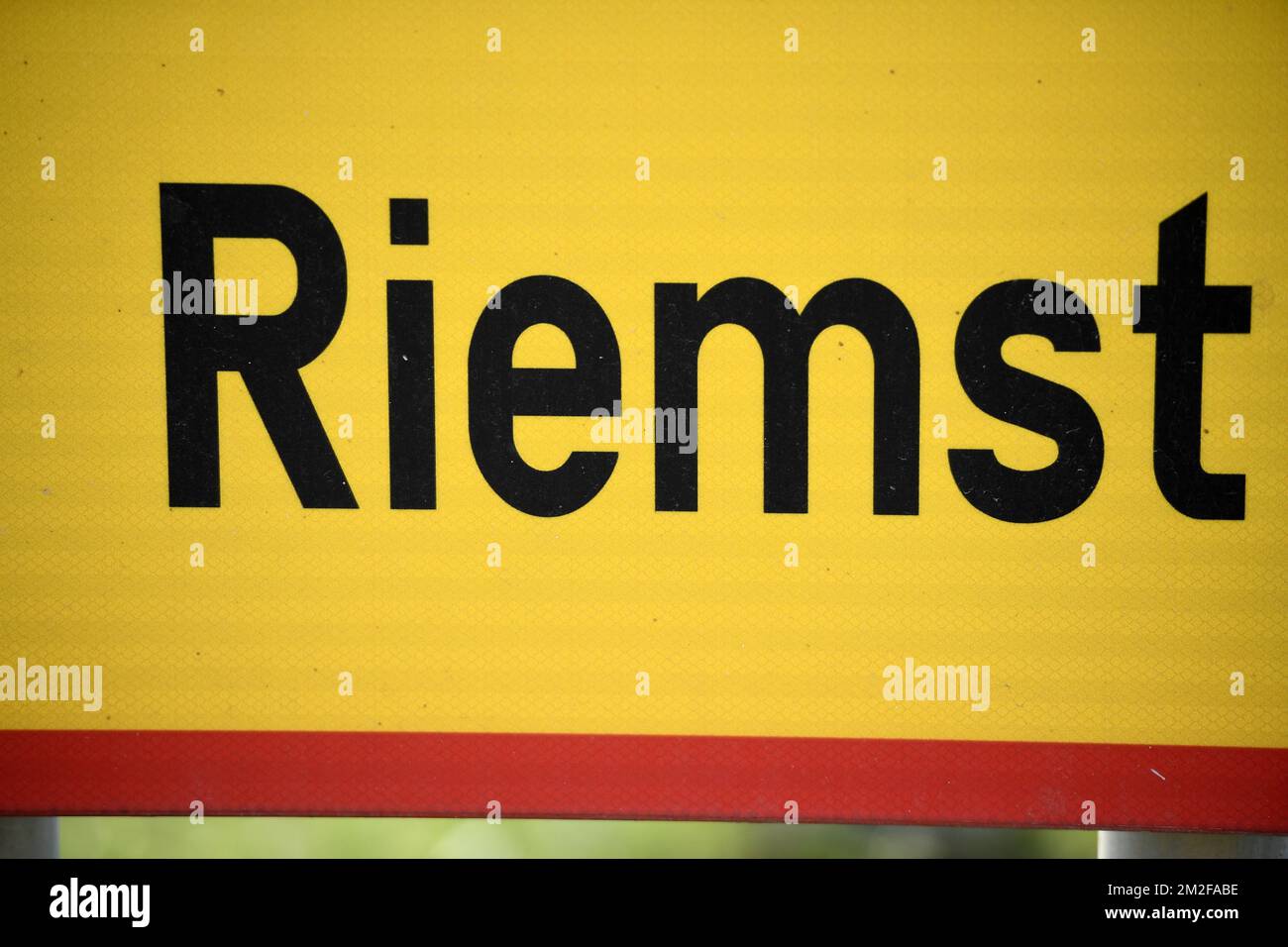 Illustration shows the name of the Riemst municipality on a road sign ...