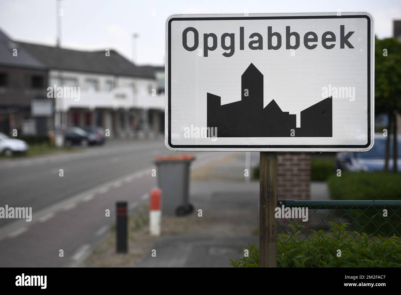 Illustration shows the name of the Opglabbeek municipality on a road ...