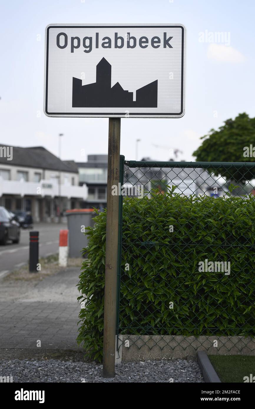 Illustration shows the name of the Opglabbeek municipality on a road ...