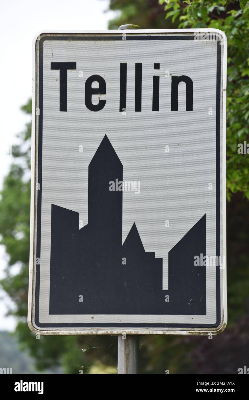 Illustration shows the name of the Tellin municipality on a road sign ...