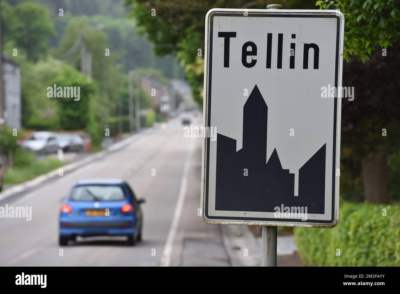 Illustration shows the name of the Tellin municipality on a road sign ...