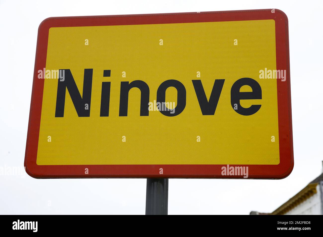 Illustration shows the name of the Ninove municipality on a road sign ...