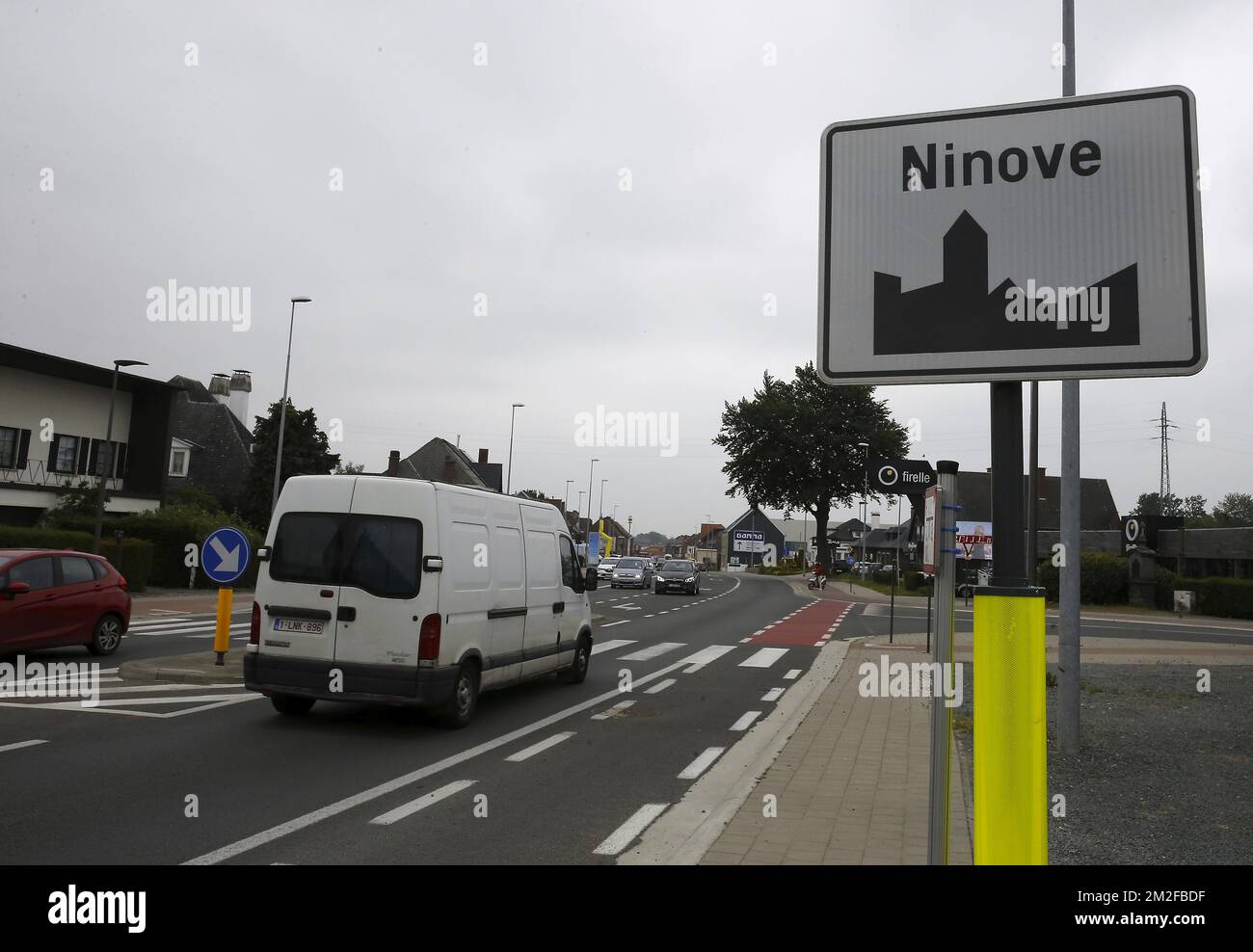 Illustration shows the name of the Ninove municipality on a road sign ...