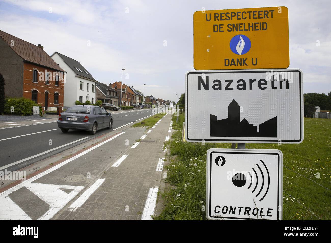 Illustration shows the name of the Nazareth municipality on a road sign ...