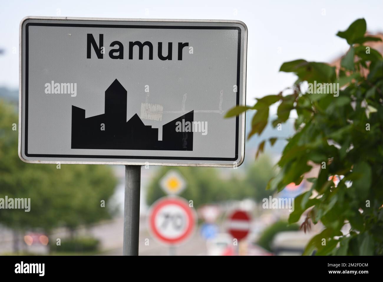Illustration shows the name of the Namur municipality on a road sign ...