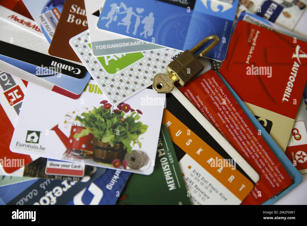 Illustration picture shows a lock with key lying between several client ...