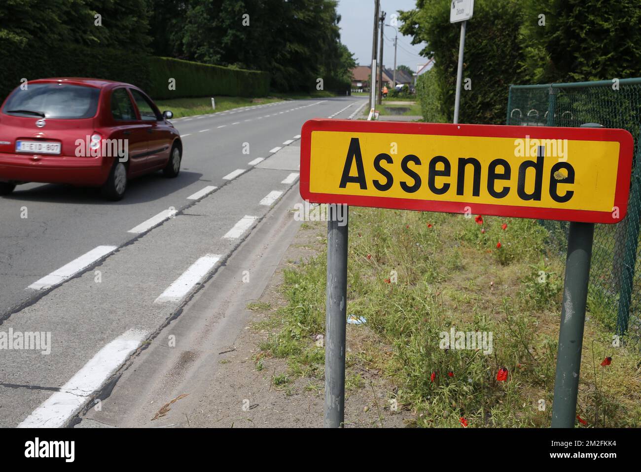 Illustration shows the name of the Assenede municipality on a road sign ...