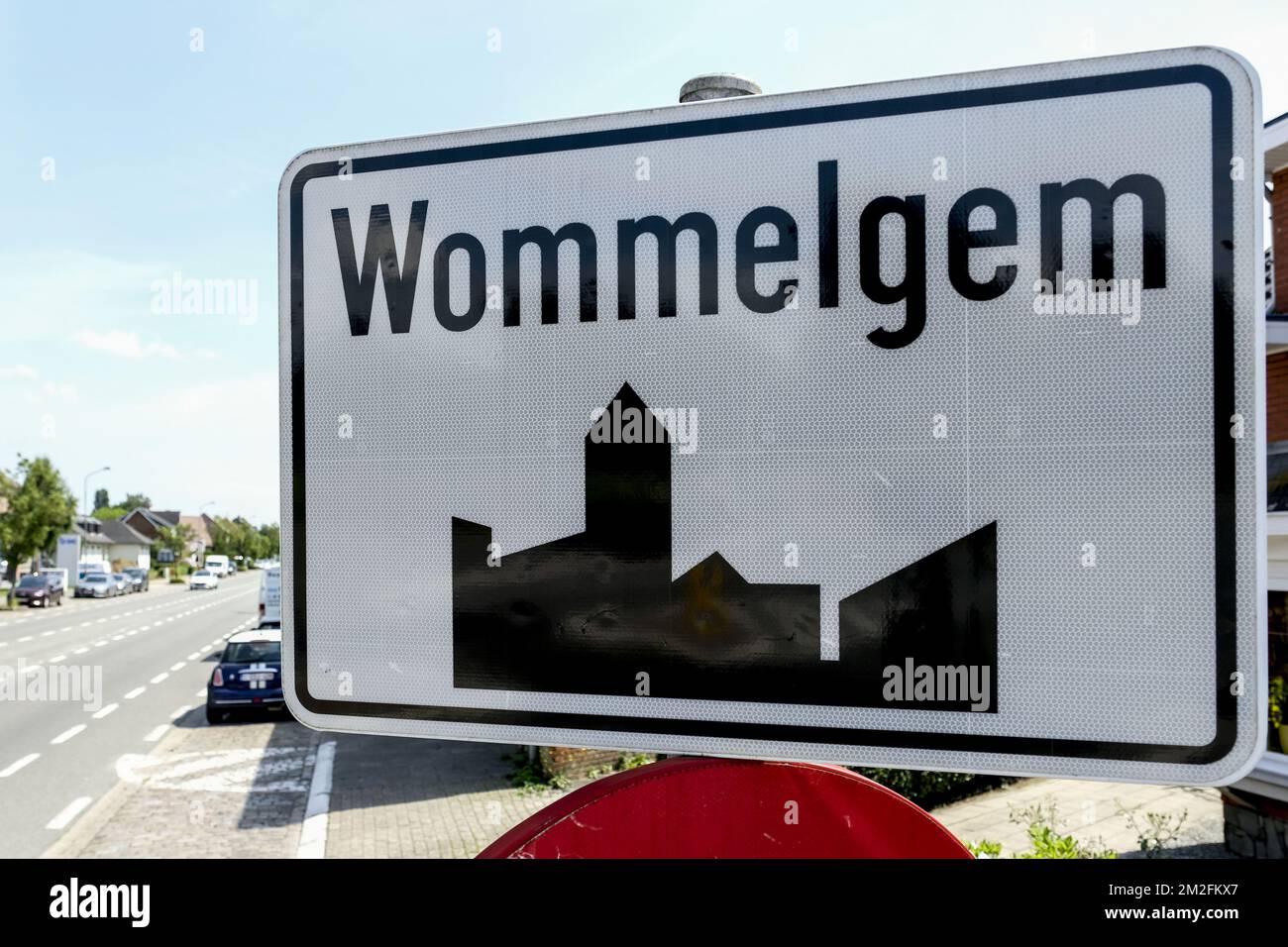 Illustration shows the name of the Wommelgem municipality on a road ...