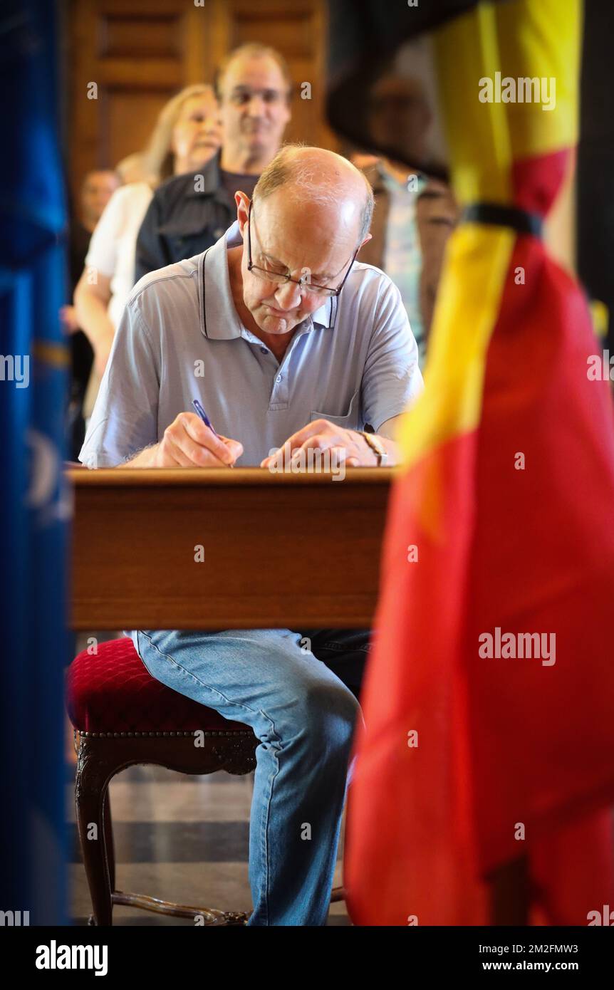 Illustration picture shows someone signing a condolence book, opened in ...