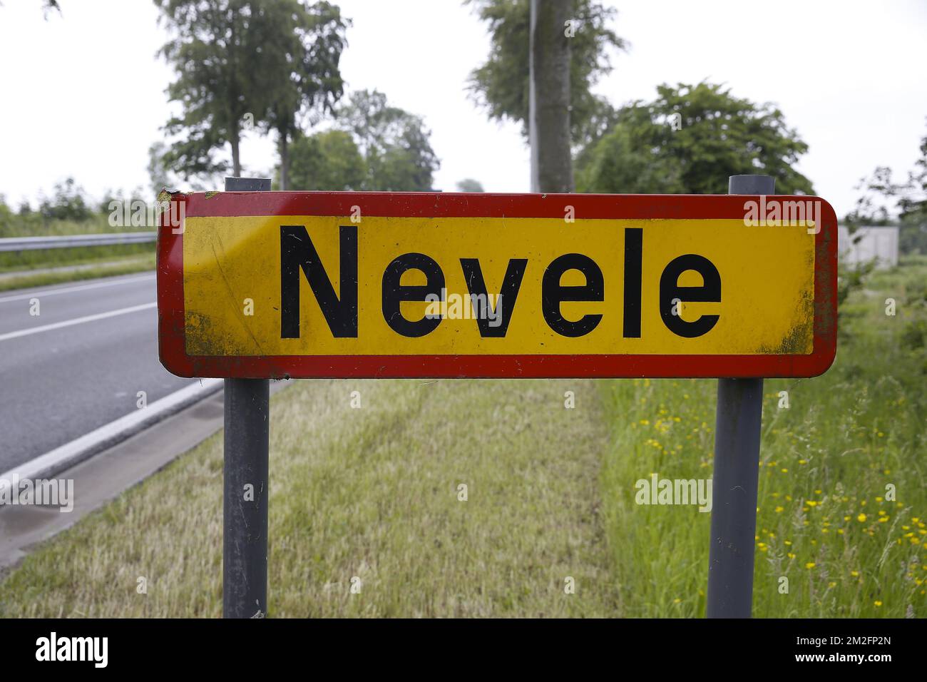Illustration shows the name of the Nevele municipality on a road sign ...