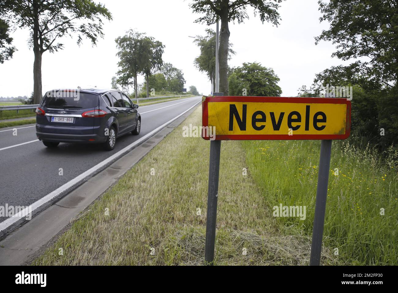 Illustration shows the name of the Nevele municipality on a road sign ...
