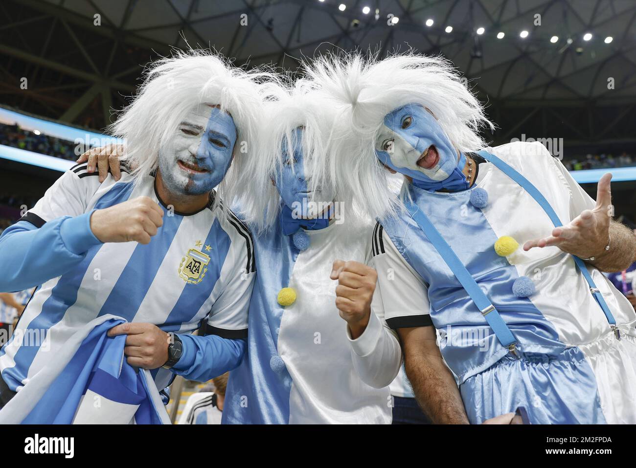 Lusail, Qatar, on Dec. 13, 2022. Fans with their faces painted in the ...