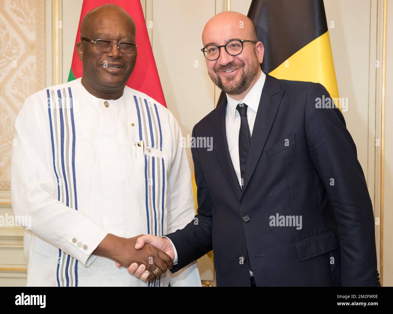 Belgian Prime Minister Charles Michel (R) welcomes Burkina Faso ...