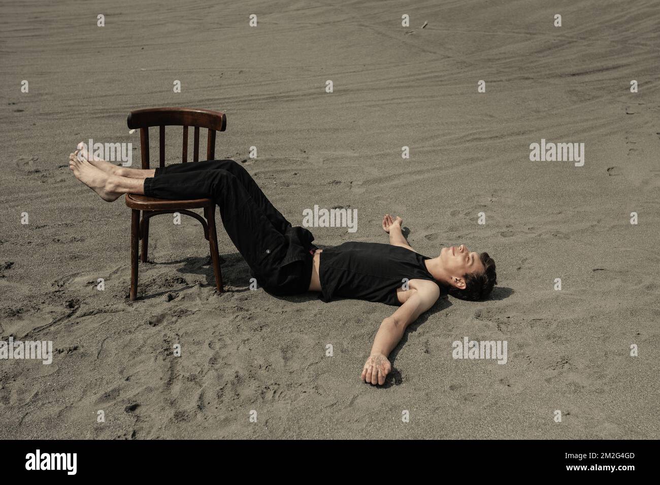 Man lying on chair hi-res stock photography and images - Alamy