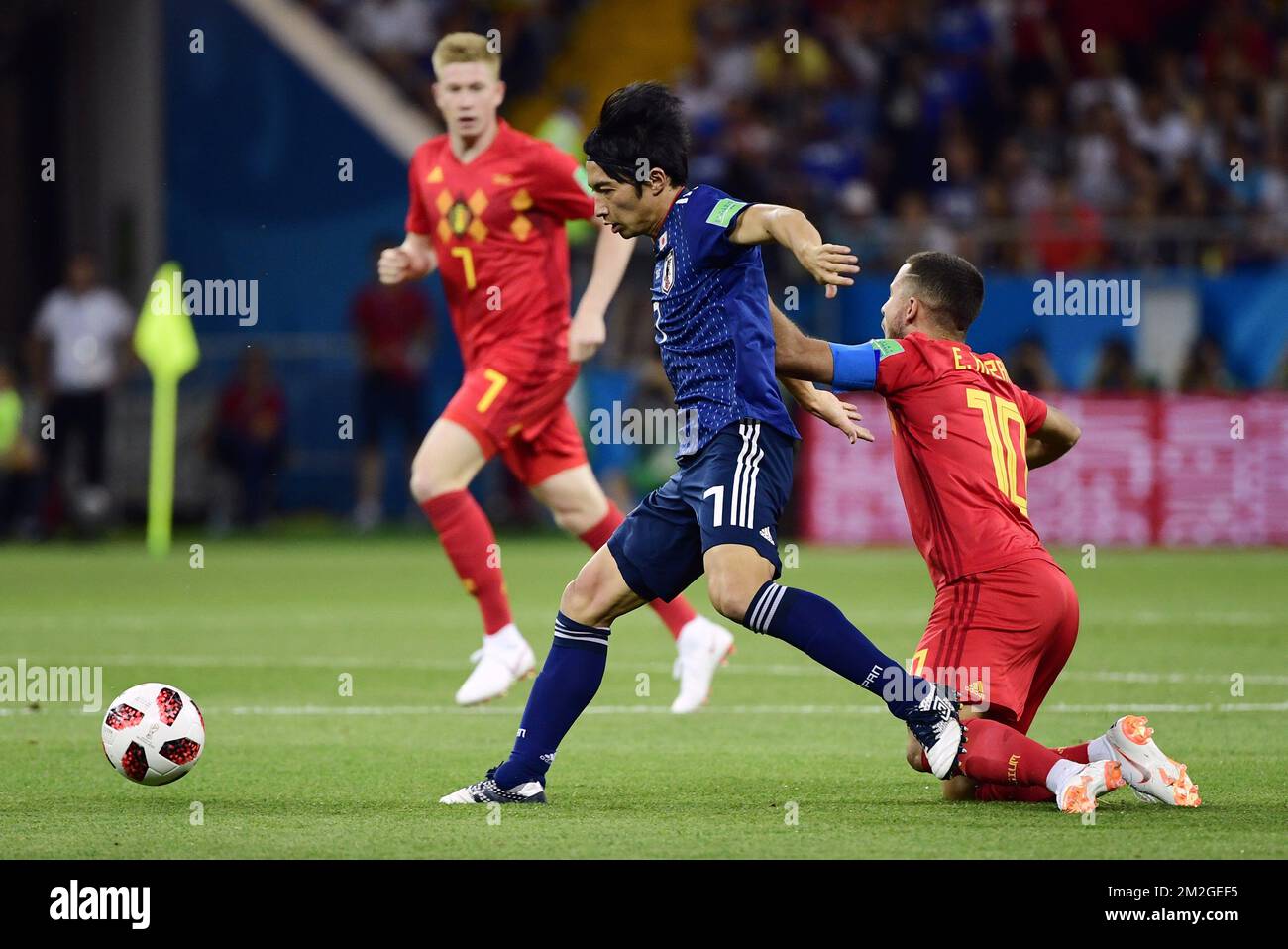 Japan's Gaku Shibasaki and Belgium's Eden Hazard fight for the ball ...