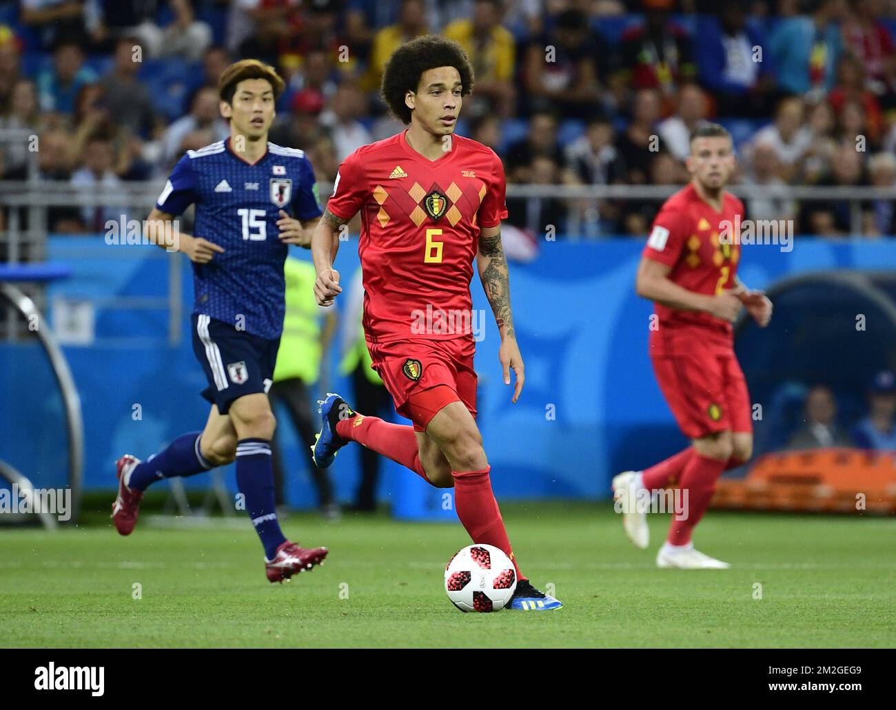Japan's Yuya Osako and Belgium's Axel Witsel fight for the ball during ...