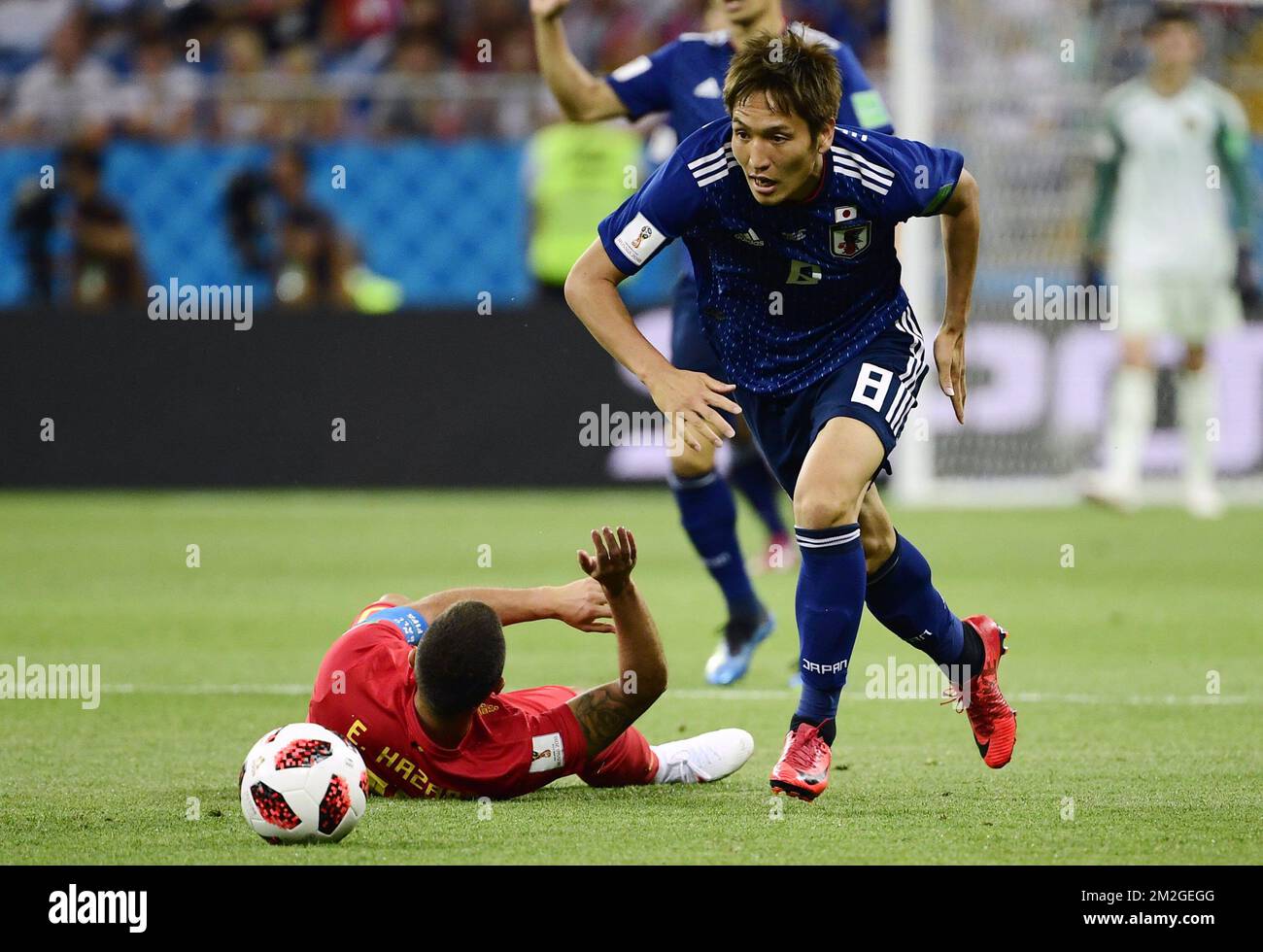Belgium's Eden Hazard and Japan's Genki Haraguchi fight for the ball ...