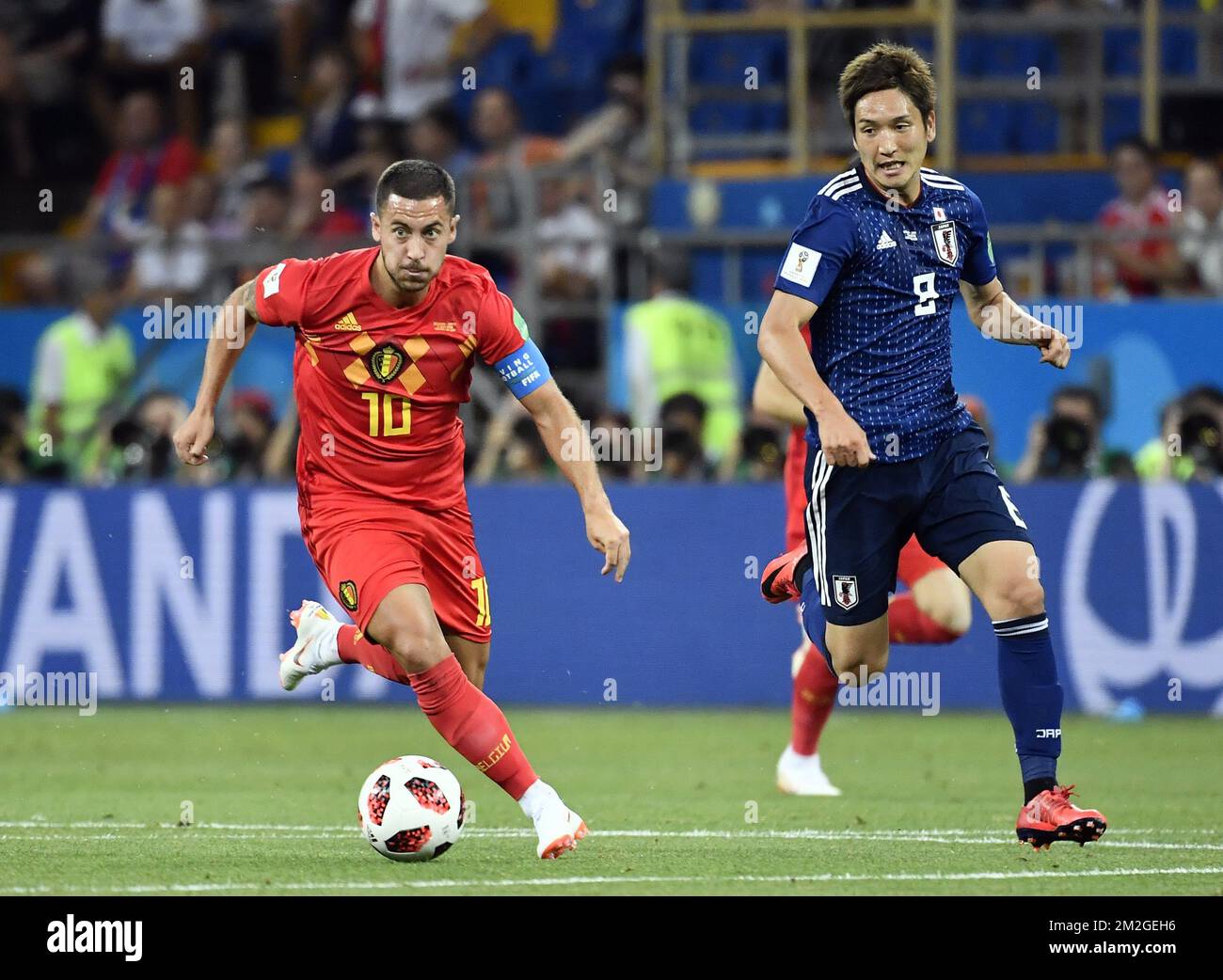 Belgium's Eden Hazard and Japan's Genki Haraguchi fight for the ball ...
