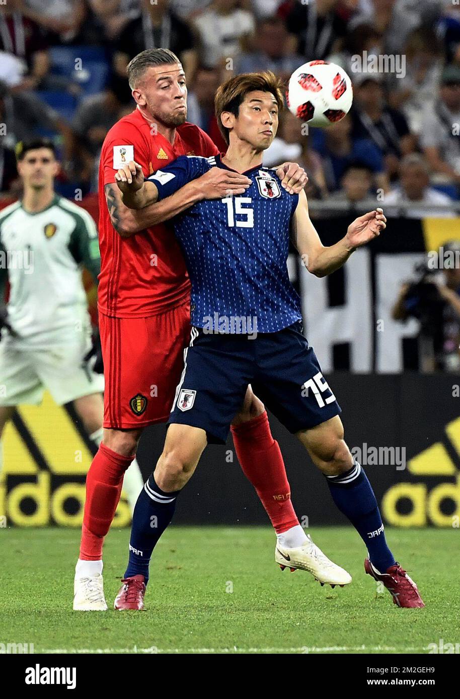Belgium's Toby Alderweireld and Japan's Yuya Osako fight for the ball ...