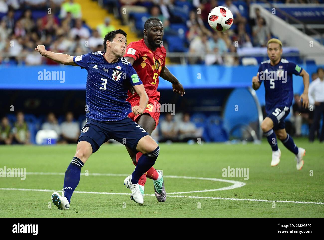 Japan's Gen Shoji and Belgium's Romelu Lukaku fight for the ball during ...