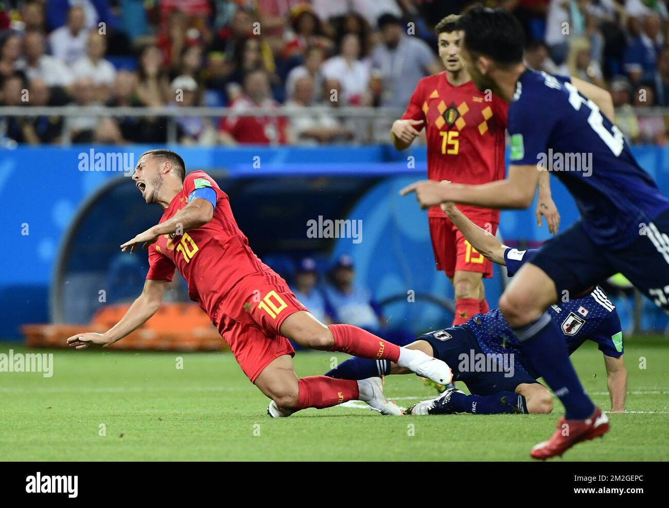 Belgium's Eden Hazard and Japan's Gaku Shibasaki fight for the ball ...