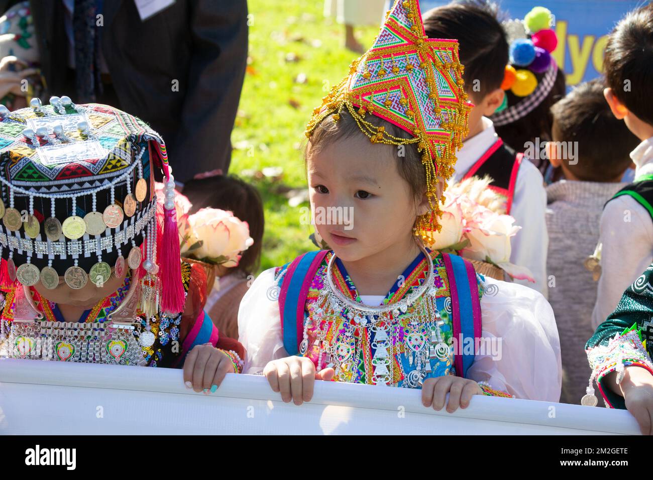 Girl dressed in traditional Hmong attire in the entry procession at the ...