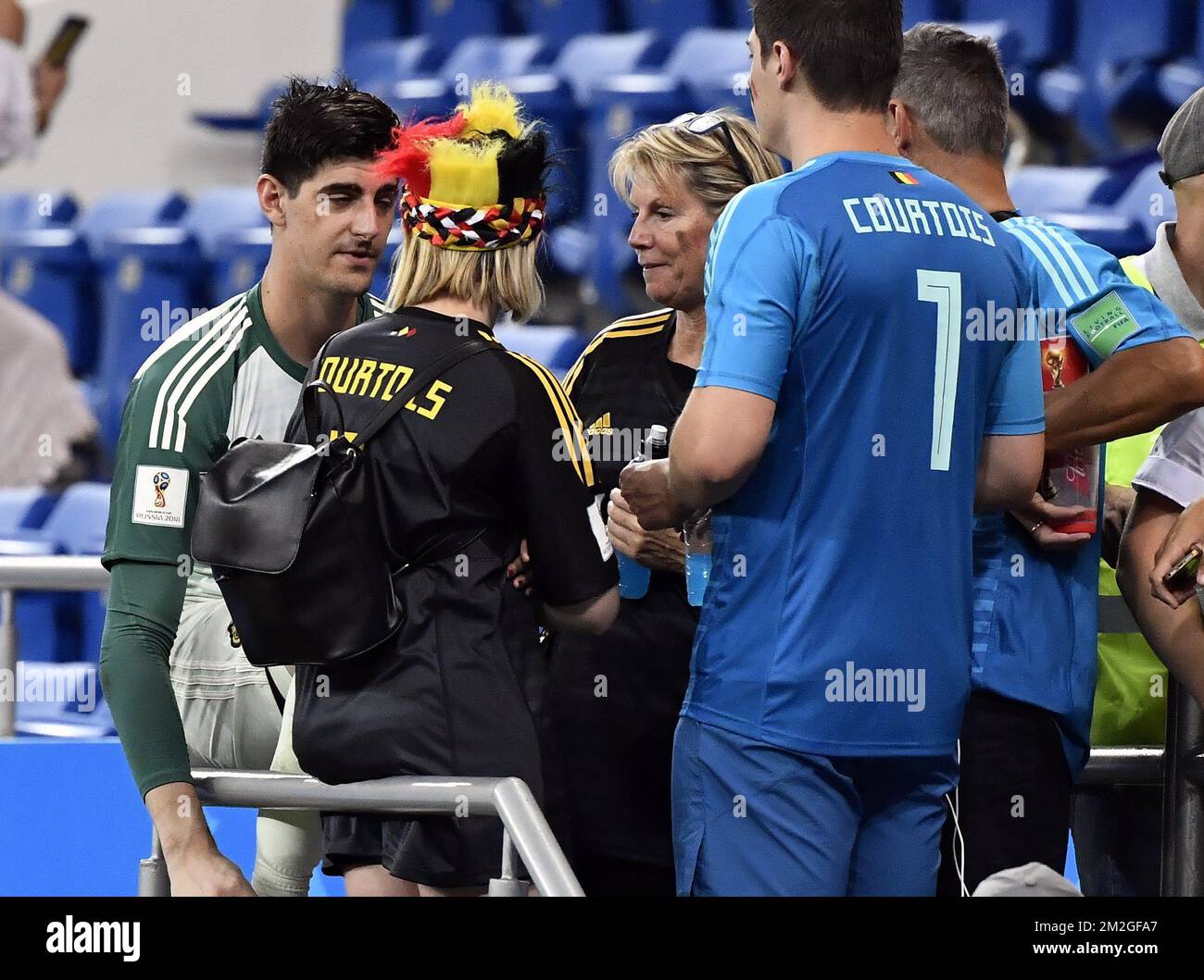 Belgium's goalkeeper Thibaut Courtois celebrates with his family after ...