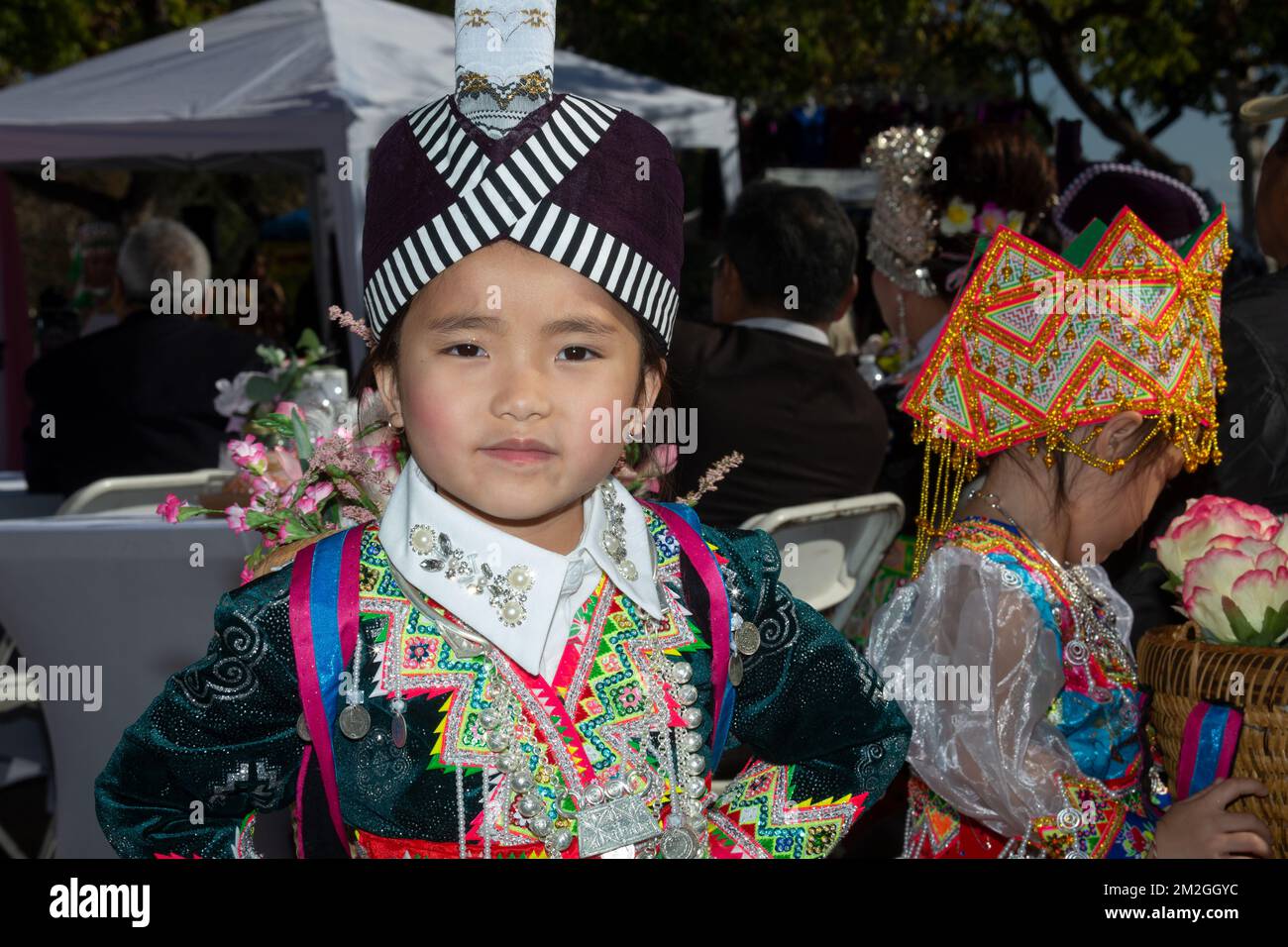 Child dressed in traditional Hmong attire at the Hmong New Year ...