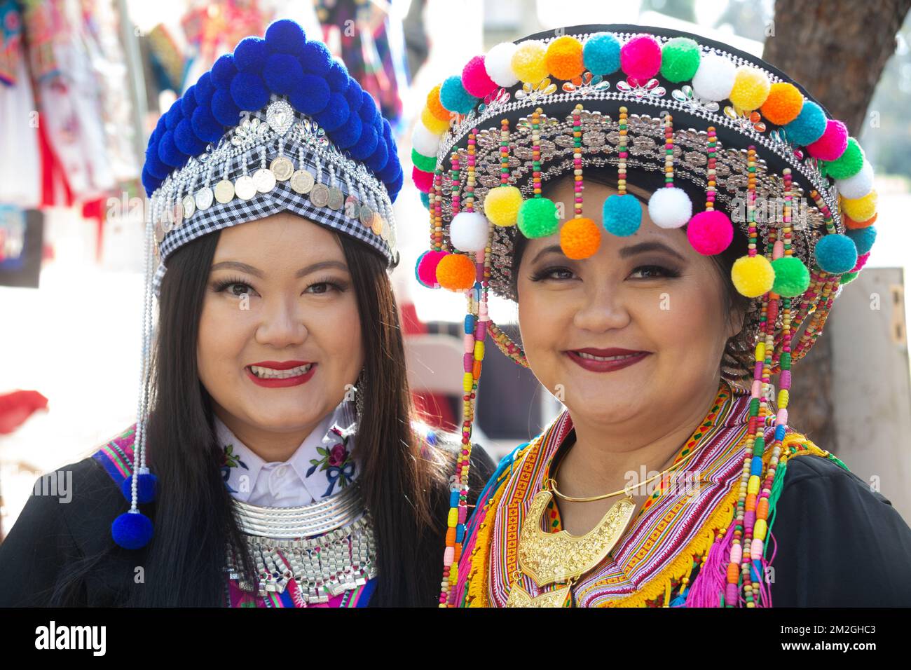 Portrait of two Hmong women in traditional attire at the Hmong New Year ...