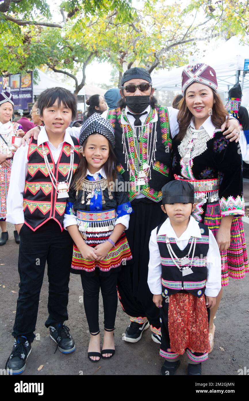 A Hmong family in traditional attire poses for a photo at the Hmong New ...