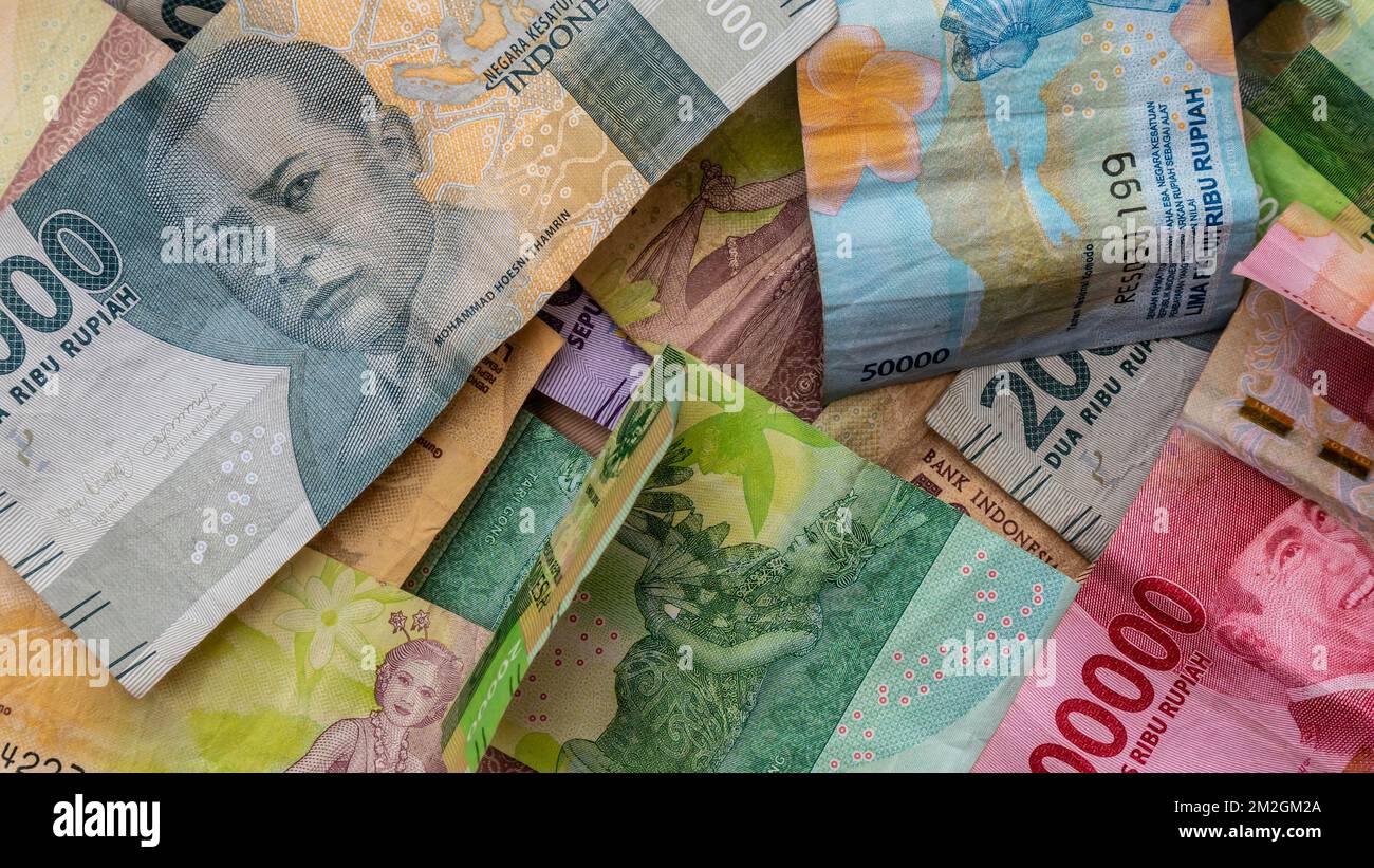 pile of rupiah banknotes as background Stock Photo - Alamy