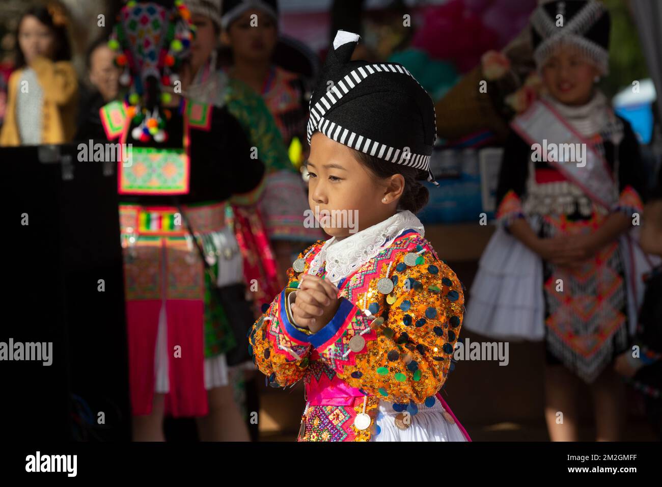 Child dressed in traditional Hmong attire at the Hmong New Year ...