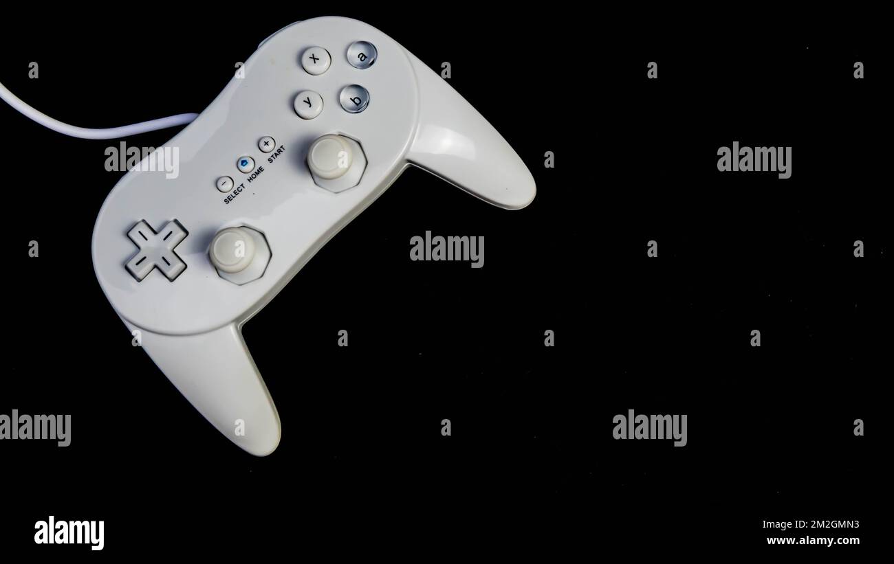 white joystick isolated on black background Stock Photo - Alamy