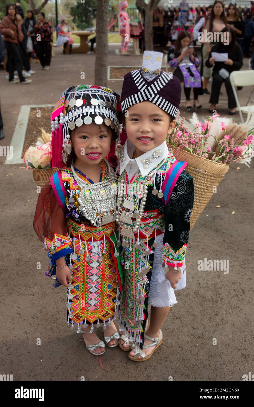 Two young girls dressed in traditional Hmong outfits at the Hmong New ...