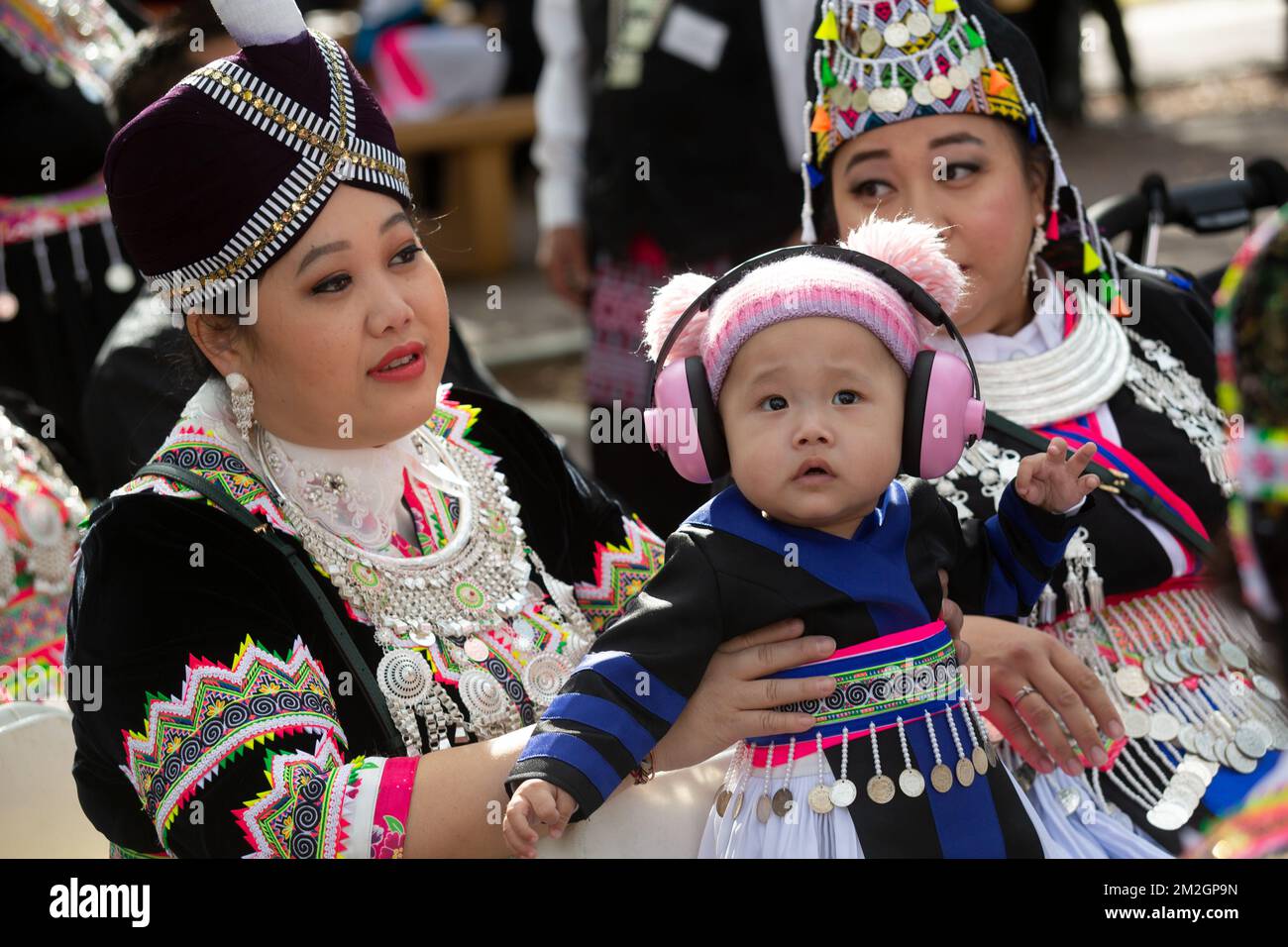 Toddler wearing ear protection at the Hmong New Year Celebration at El ...