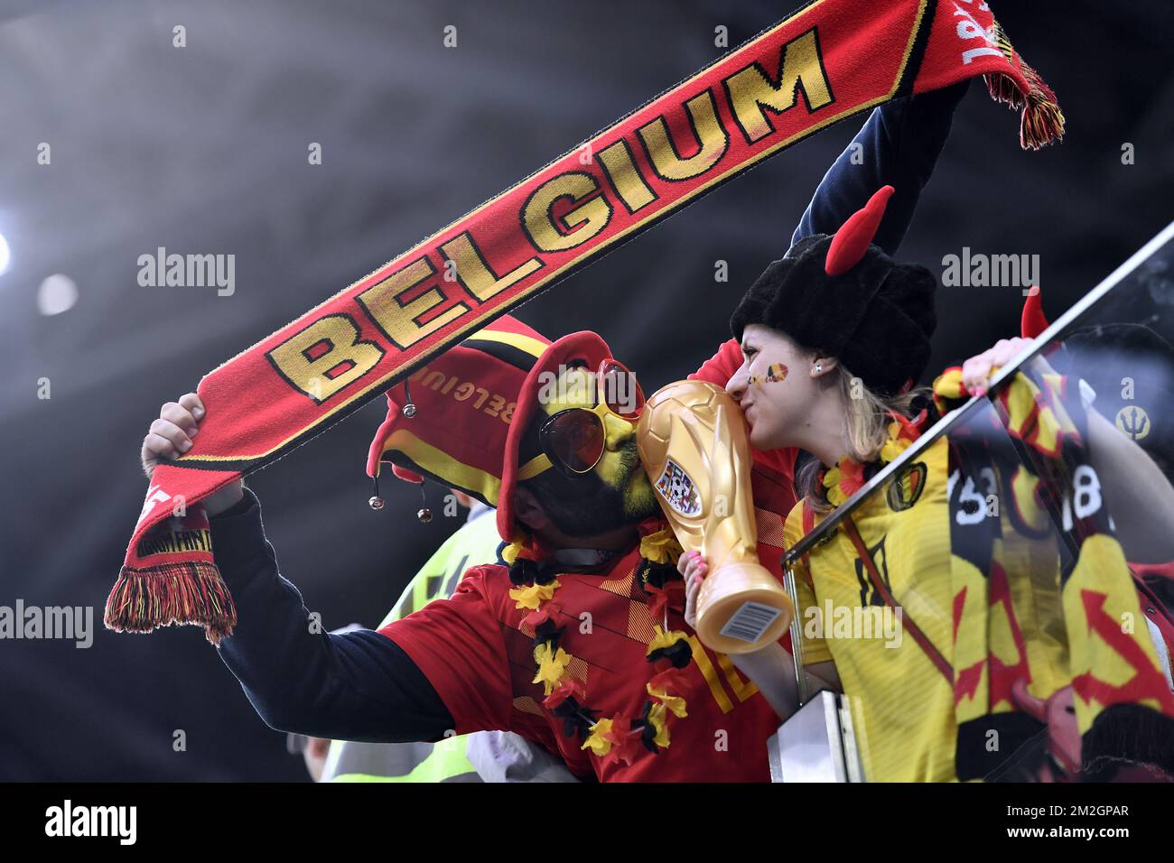 Belgium's supporters kiss a World Cup trophy replica, during the semi ...