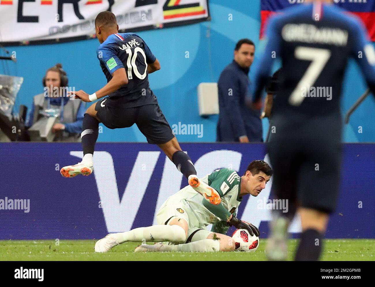 Belgium's goalkeeper Thibaut Courtois and France's Kylian Mbappe ...