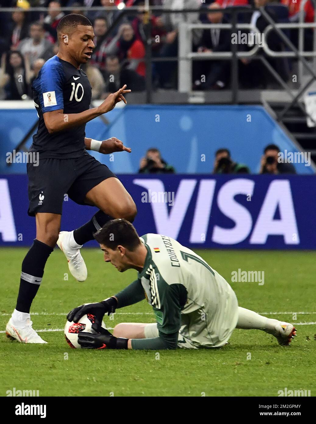 France's Kylian Mbappe and Belgium's goalkeeper Thibaut Courtois fight ...