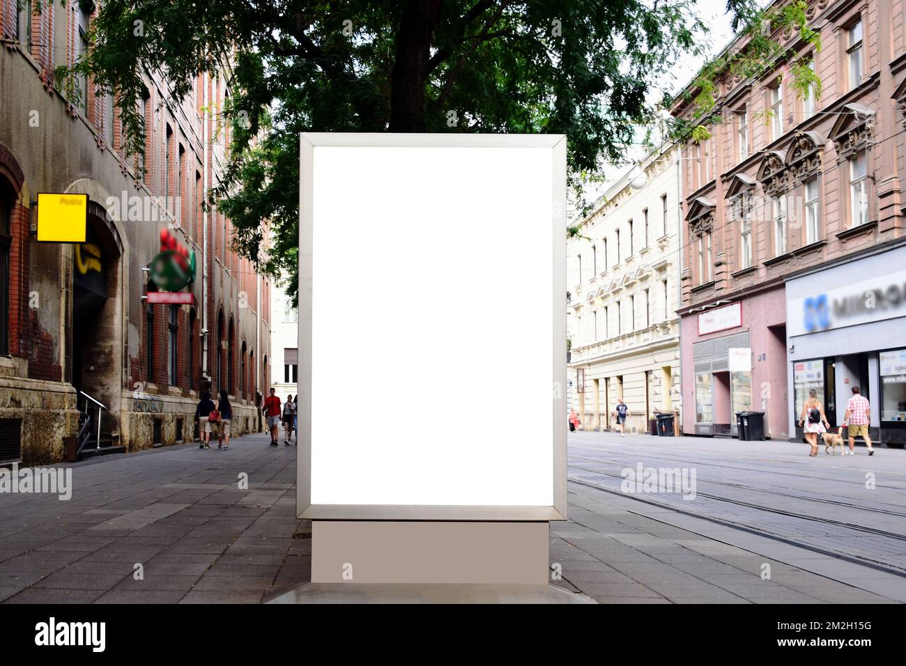 billboard ad at busstop. blank white lightbox. urban setting. city ...